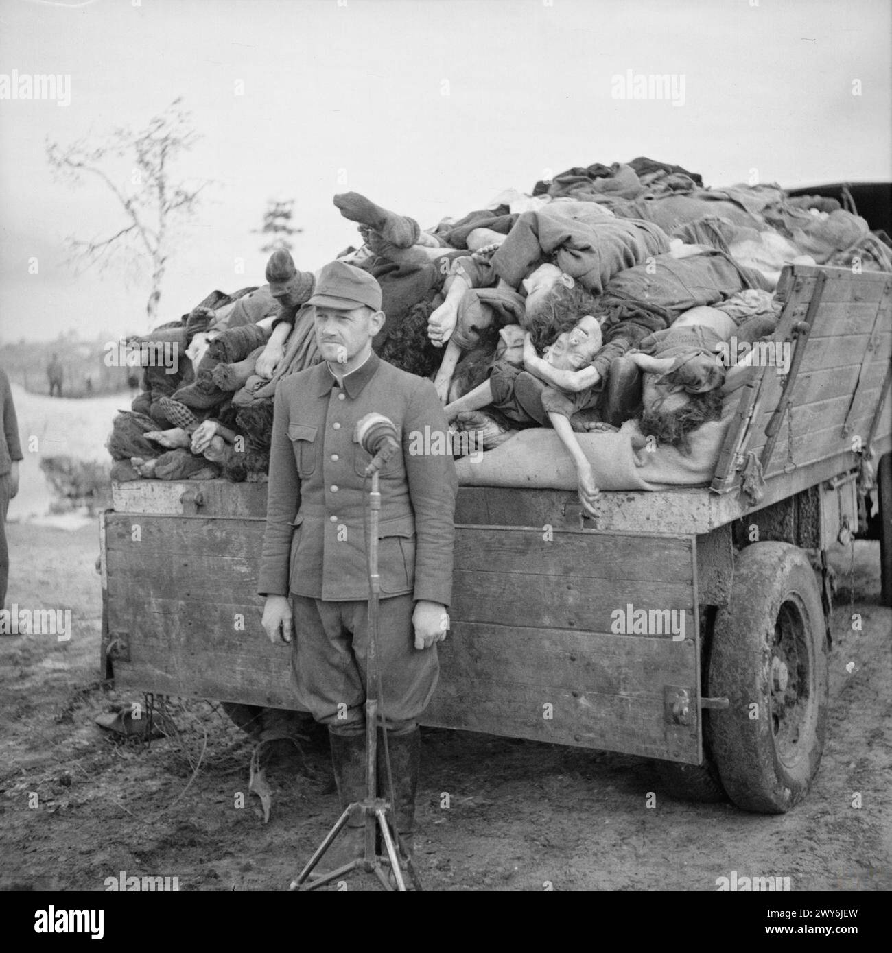 Oberleutnant F. Hosler, an SS officer, stands by a microphone at Bergen ...