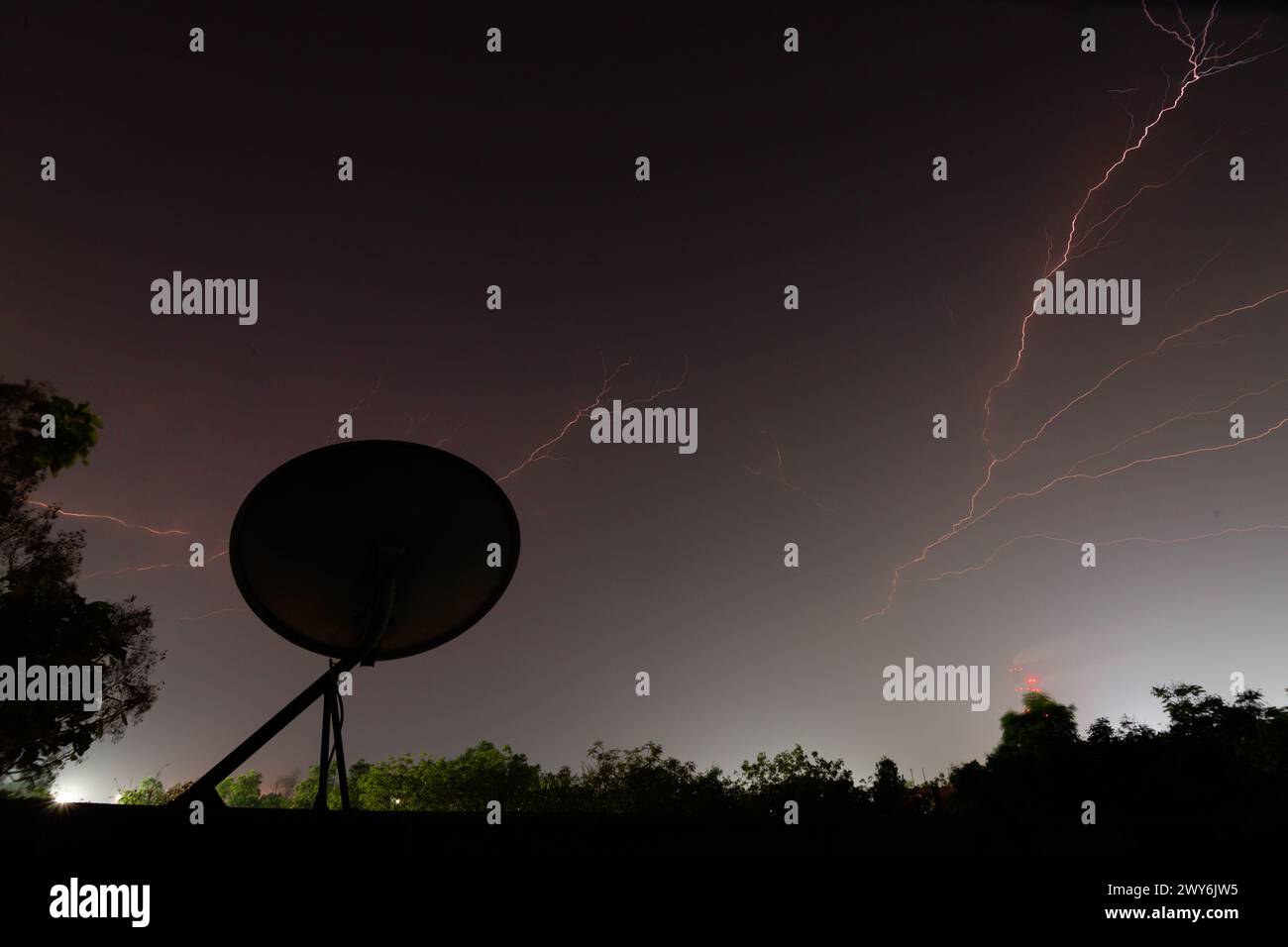 A night sky view with huge thunder and lightning strike in a stormy ...
