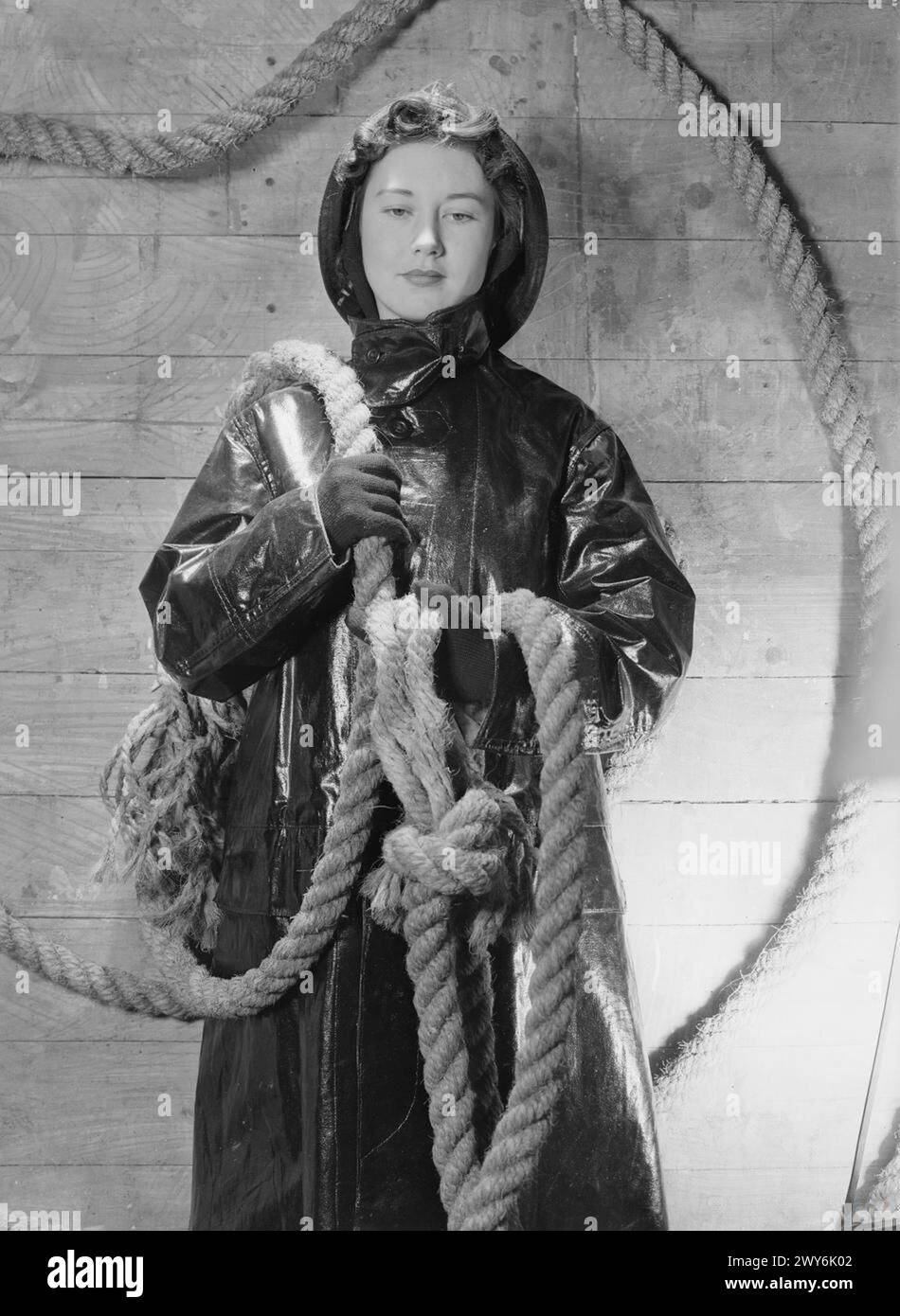 WOMEN'S ROYAL NAVAL SERVICE. - A Wren messenger on an exposed station ...