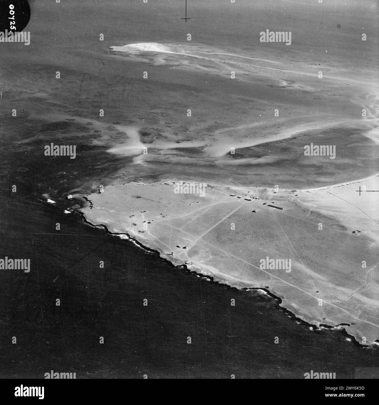 Oblique aerial reconnaissance of an Italian military airfield on Harmil ...