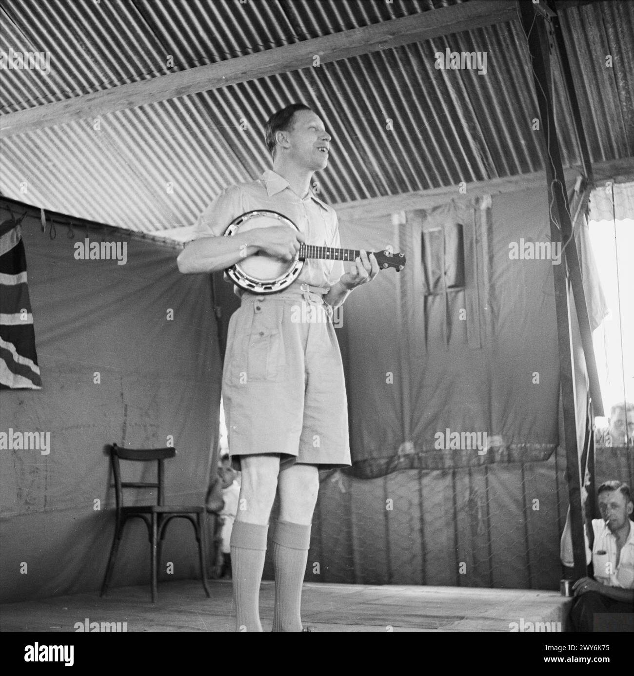 GEORGE FORMBY ENTERTAINS NORTH AFRICA TROOPS, 1943 - In an improvised theatre in the grounds of ...