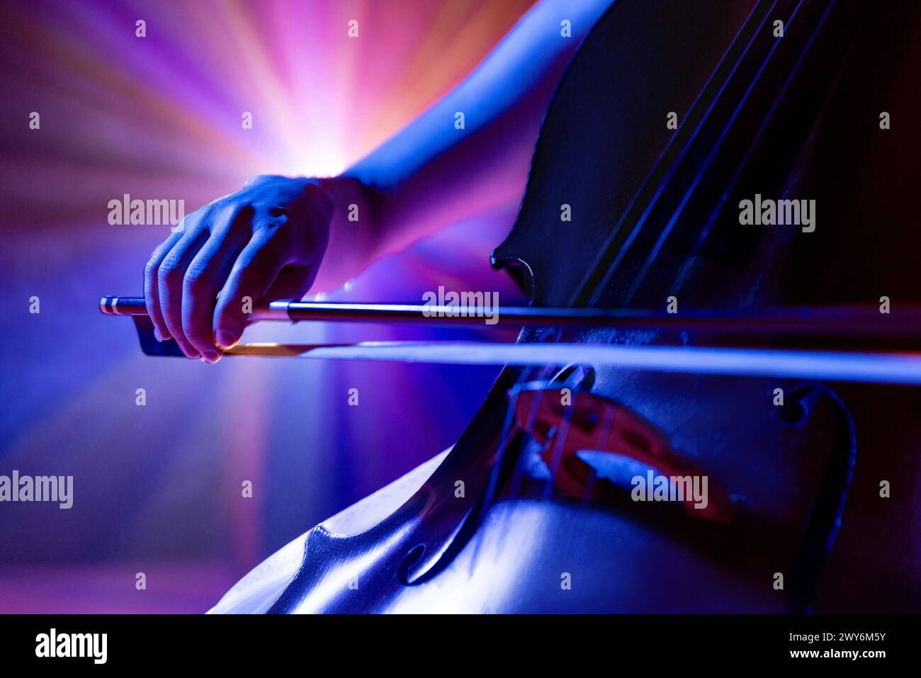 Close up photo of skilled musician, cellist performing symphony in ...