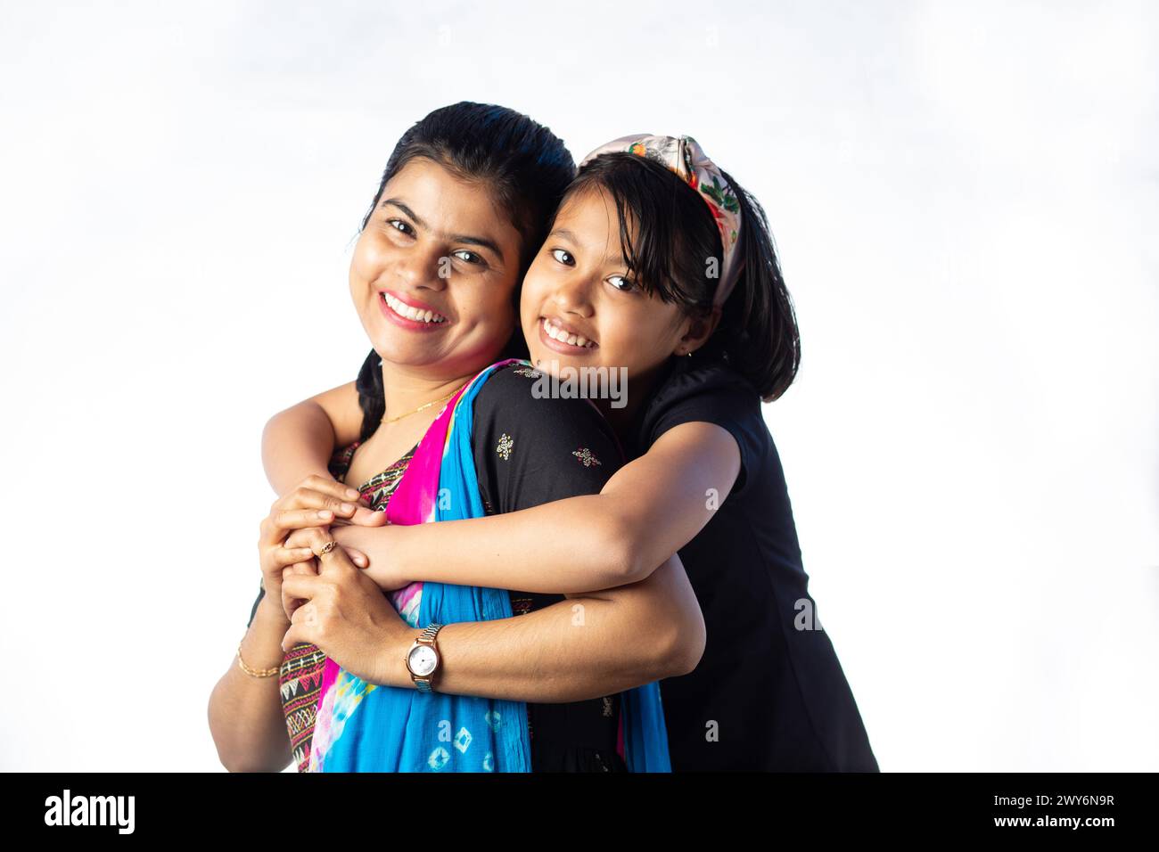 Indian mother and child daughter embracing hugging each other with ...