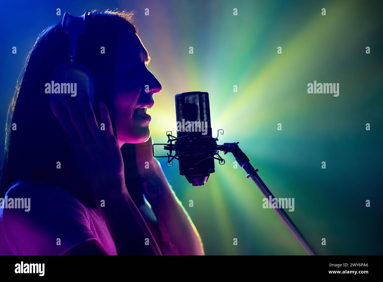 Singer's profile portrait performing new song against dynamic backdrop ...