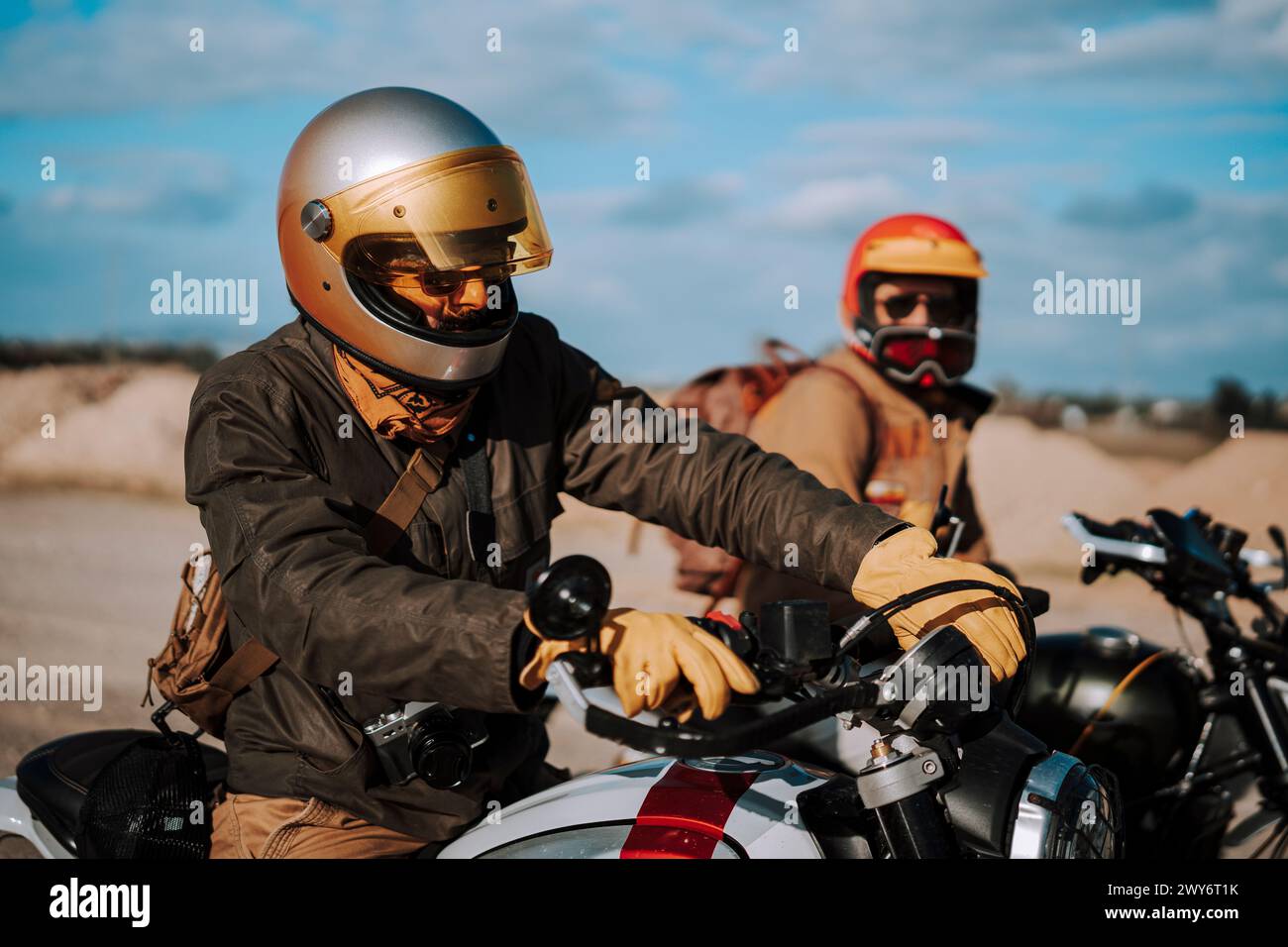 Two bikers on motorcycles riding in the desert Stock Photo - Alamy