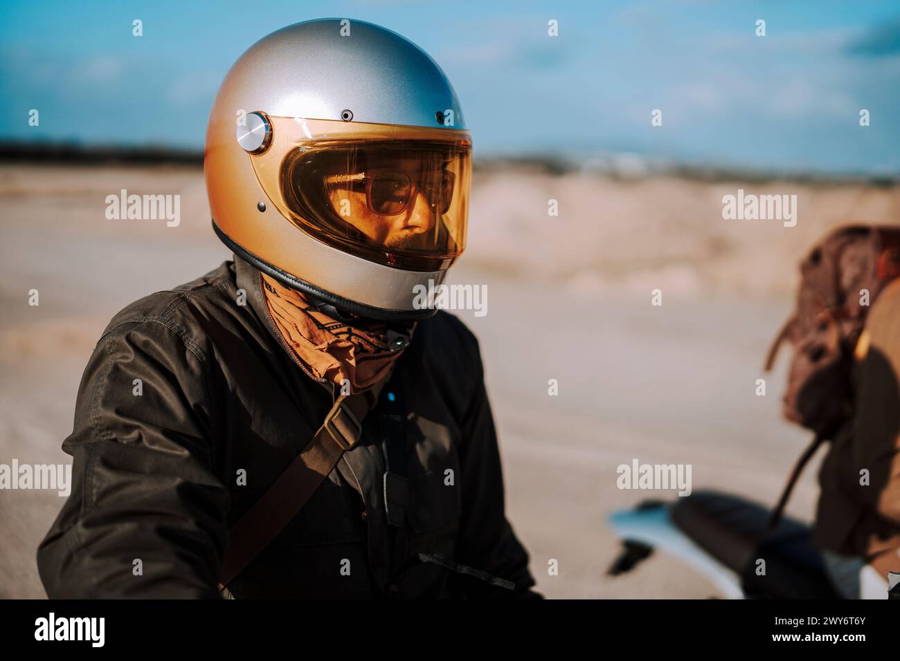 Man in helmet rides motorcycle with friends Stock Photo - Alamy