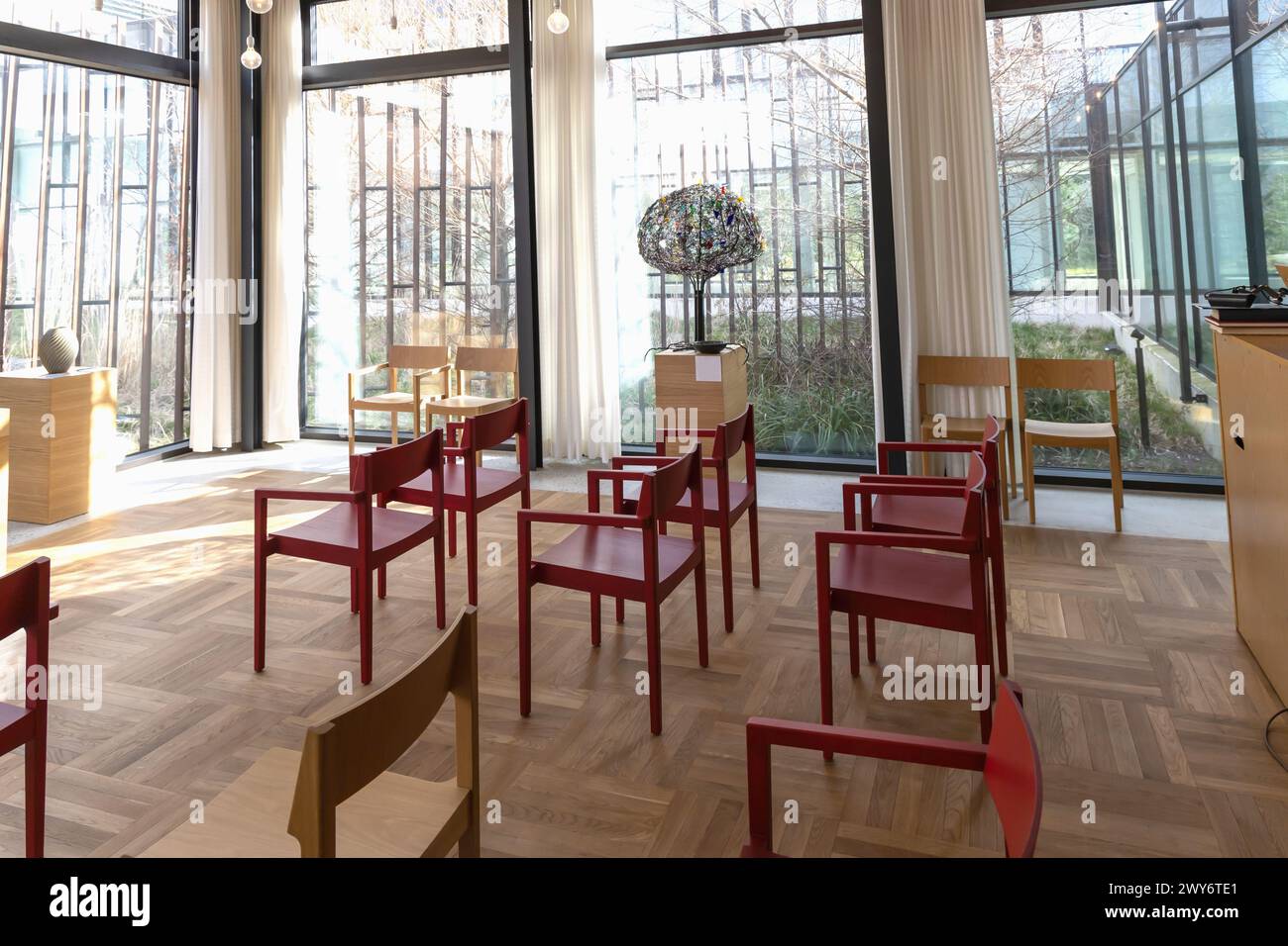 Church room for prayer and privacy with a large cross and chairs for ...