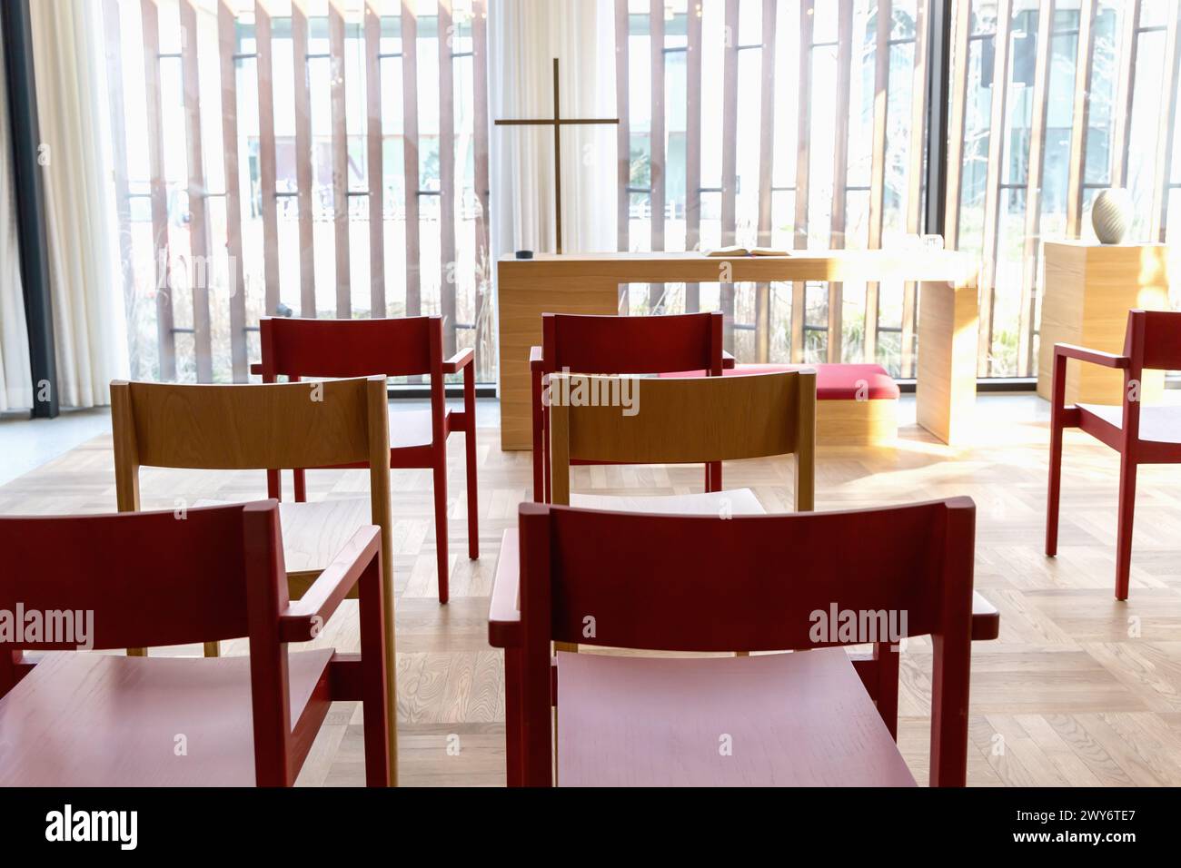 Church room for prayer and privacy with a large cross and chairs for ...