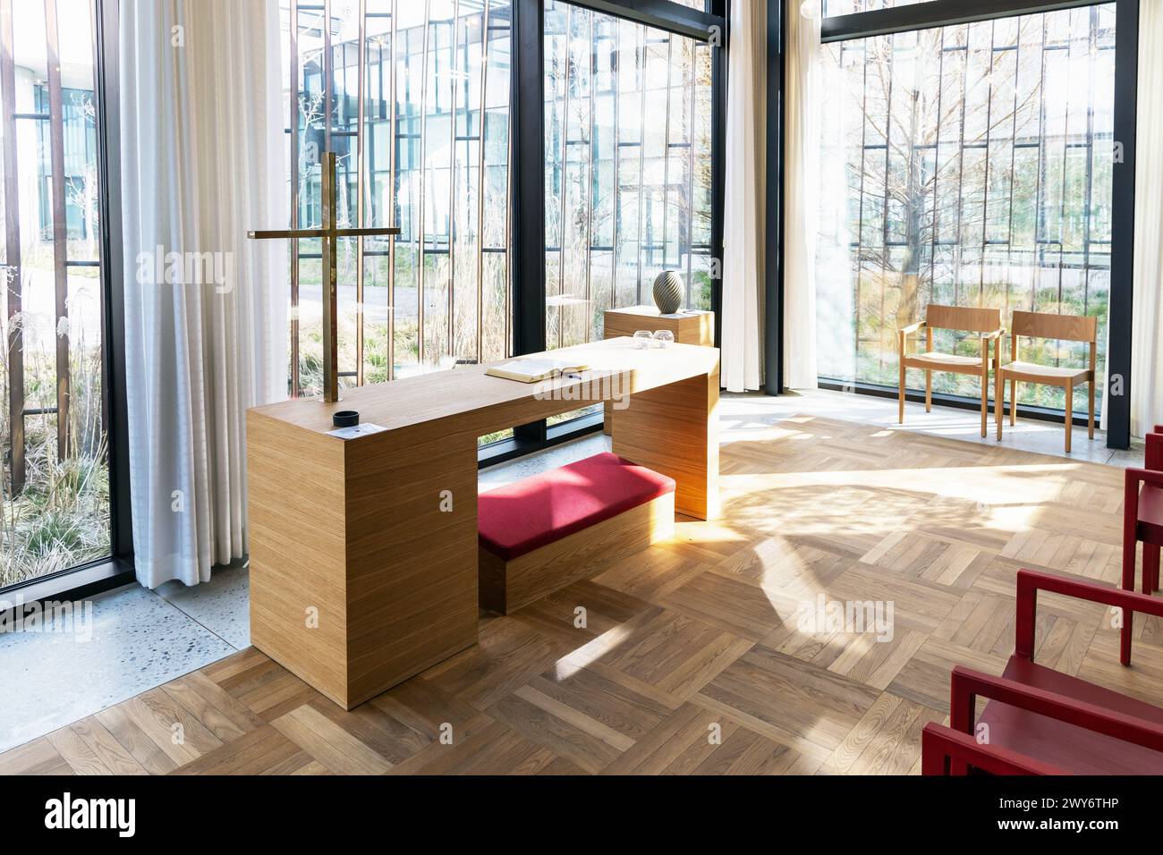 Church room for prayer and privacy with a large cross and chairs for ...