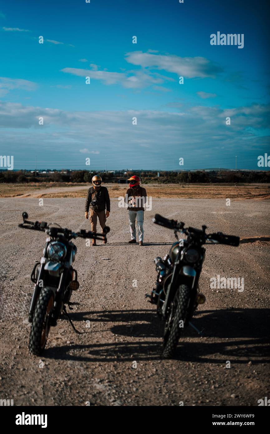 Three motorcycles parked in the desert field Stock Photo - Alamy