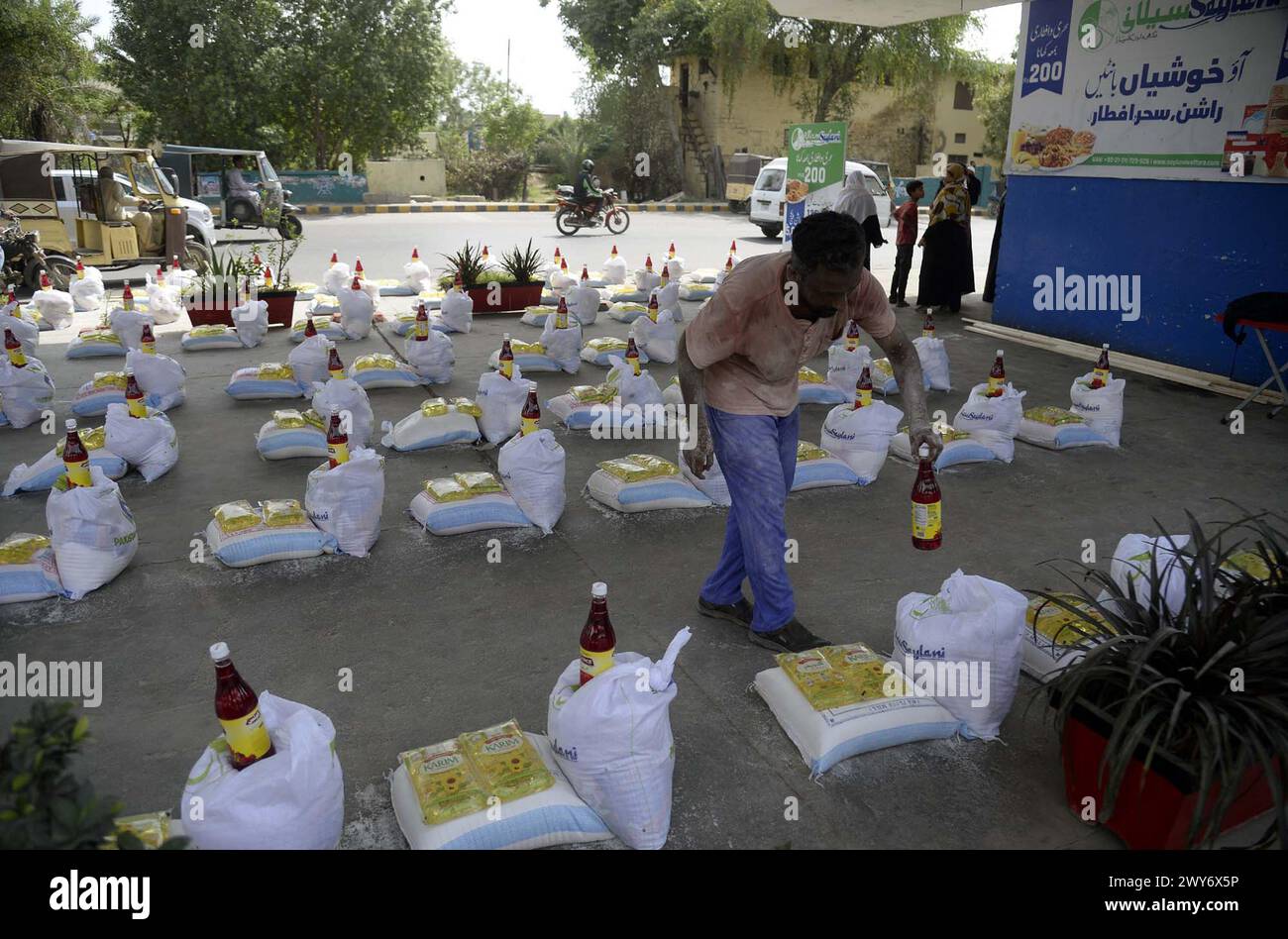 Relief goods is being distributed among needy persons during food aids ...