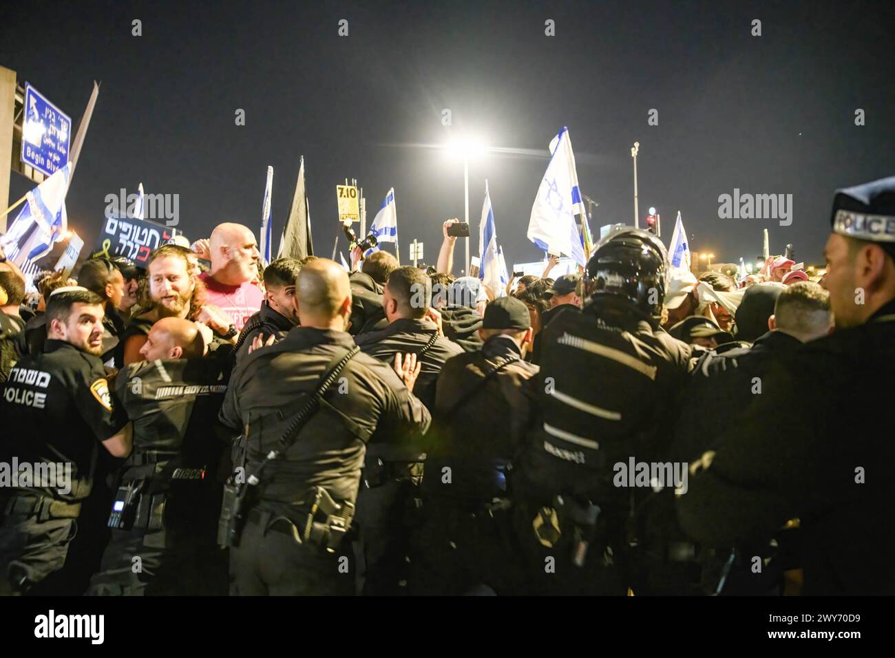 Israeli police officers try to block protestors from reaching the Begin ...