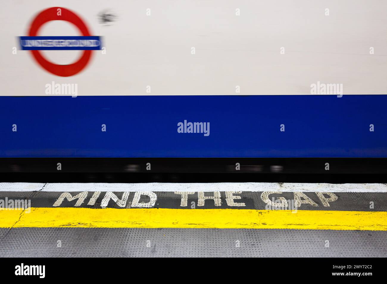 London, UK - March 24, 2024; Mind The Gap warning on platform with ...
