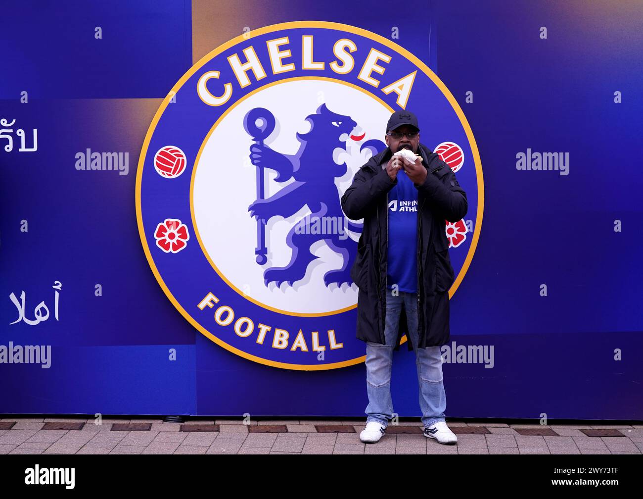 A Chelsea fan outside the ground before the Premier League match at ...