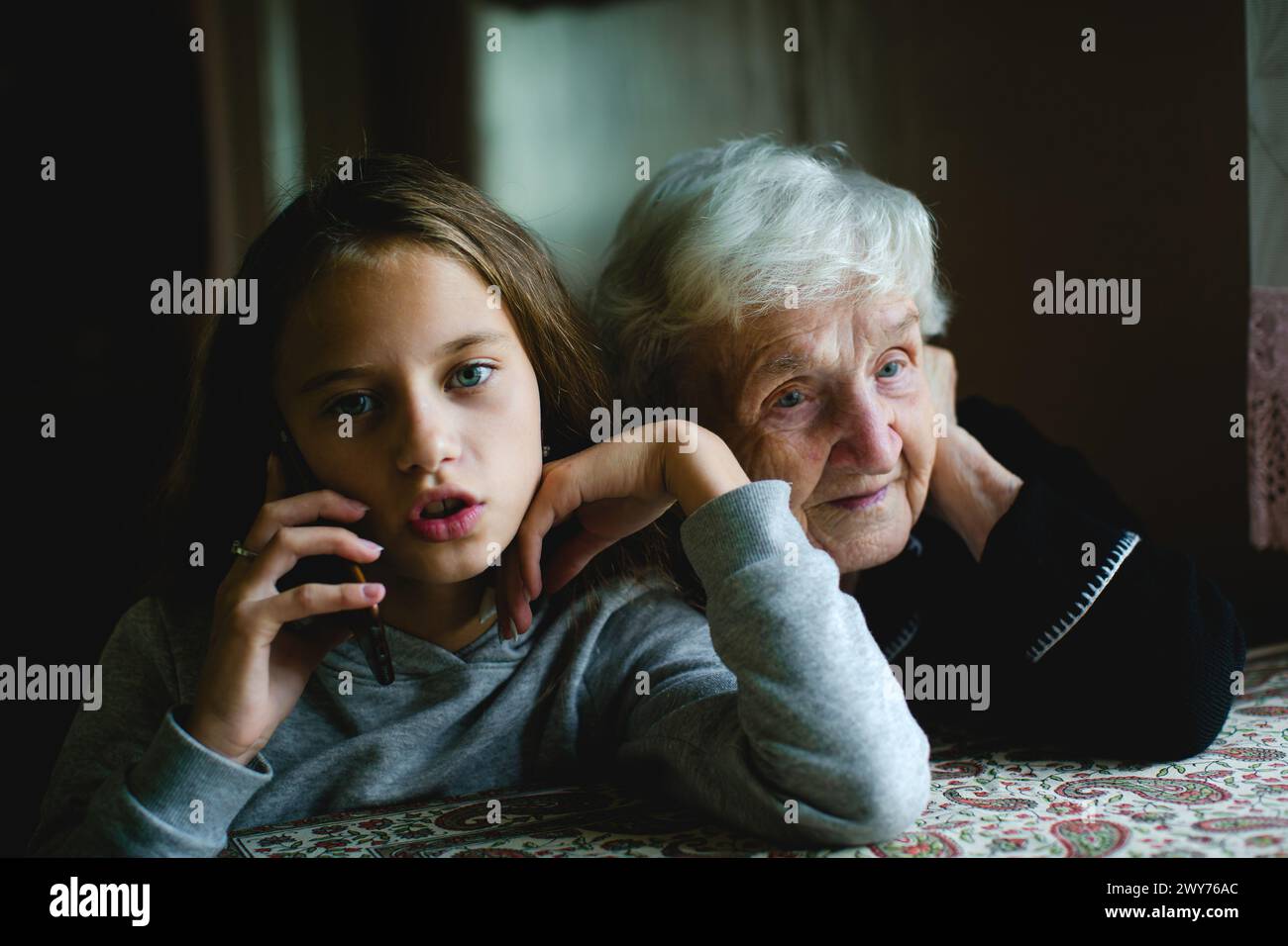 Grandma overhears her granddaughter talking on the phone Stock Photo ...