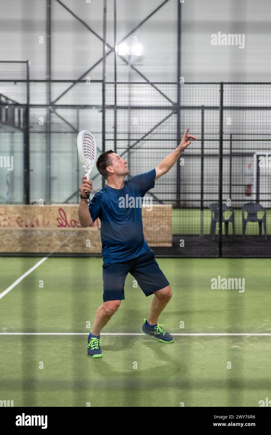Padel Tennis Player with Racket in Hand. Paddle tennis, on a green ...