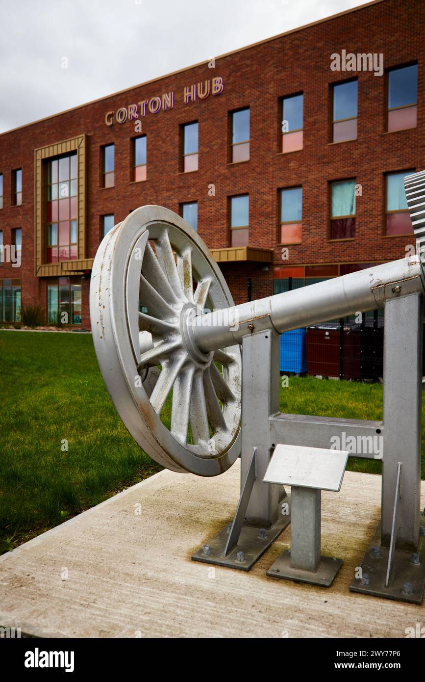 Gorton Hub community building with railway wheel statue to represent ...