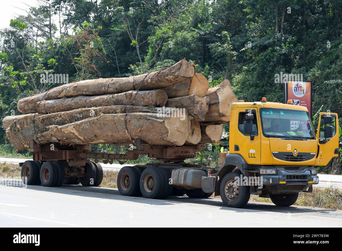 GHANA, Eastern region, Nkawkaw, timber transport on highway from Kumasi ...