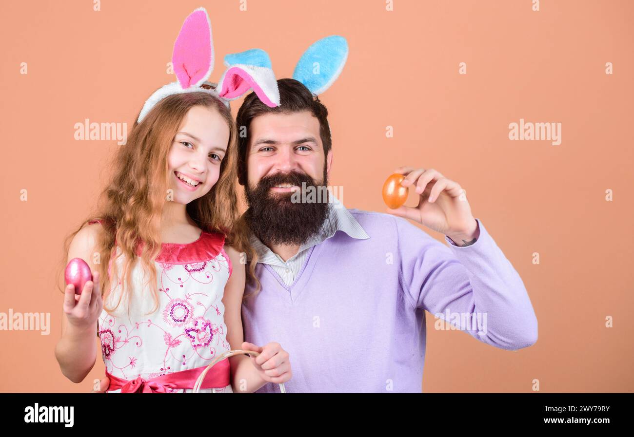 Hope and rebirth. Happy father and child with colored Easter eggs ...