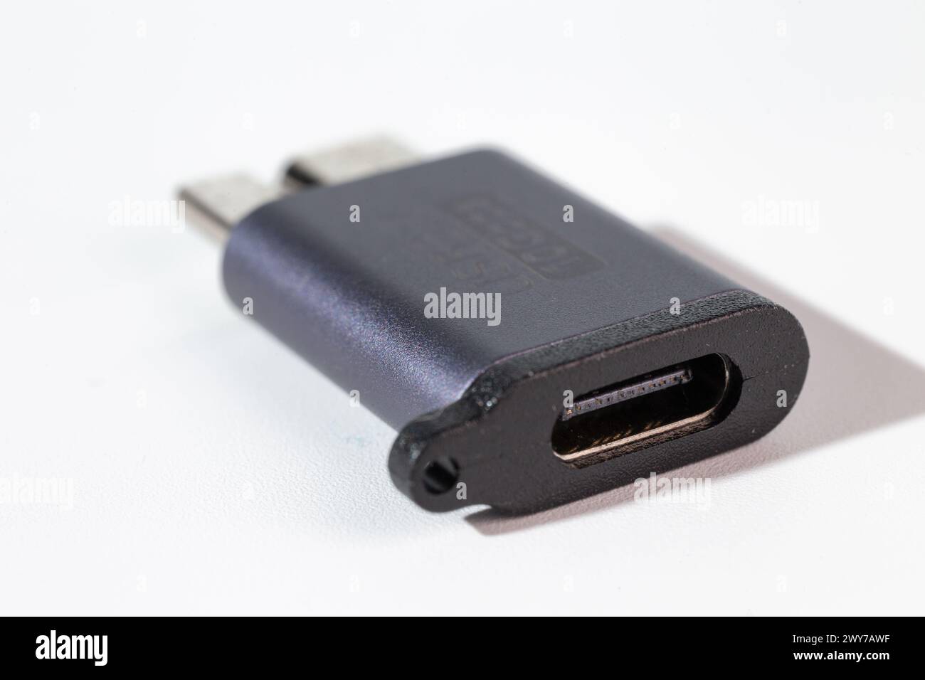 This high-quality image displays a black Type-C to Micro-USB adapter ...