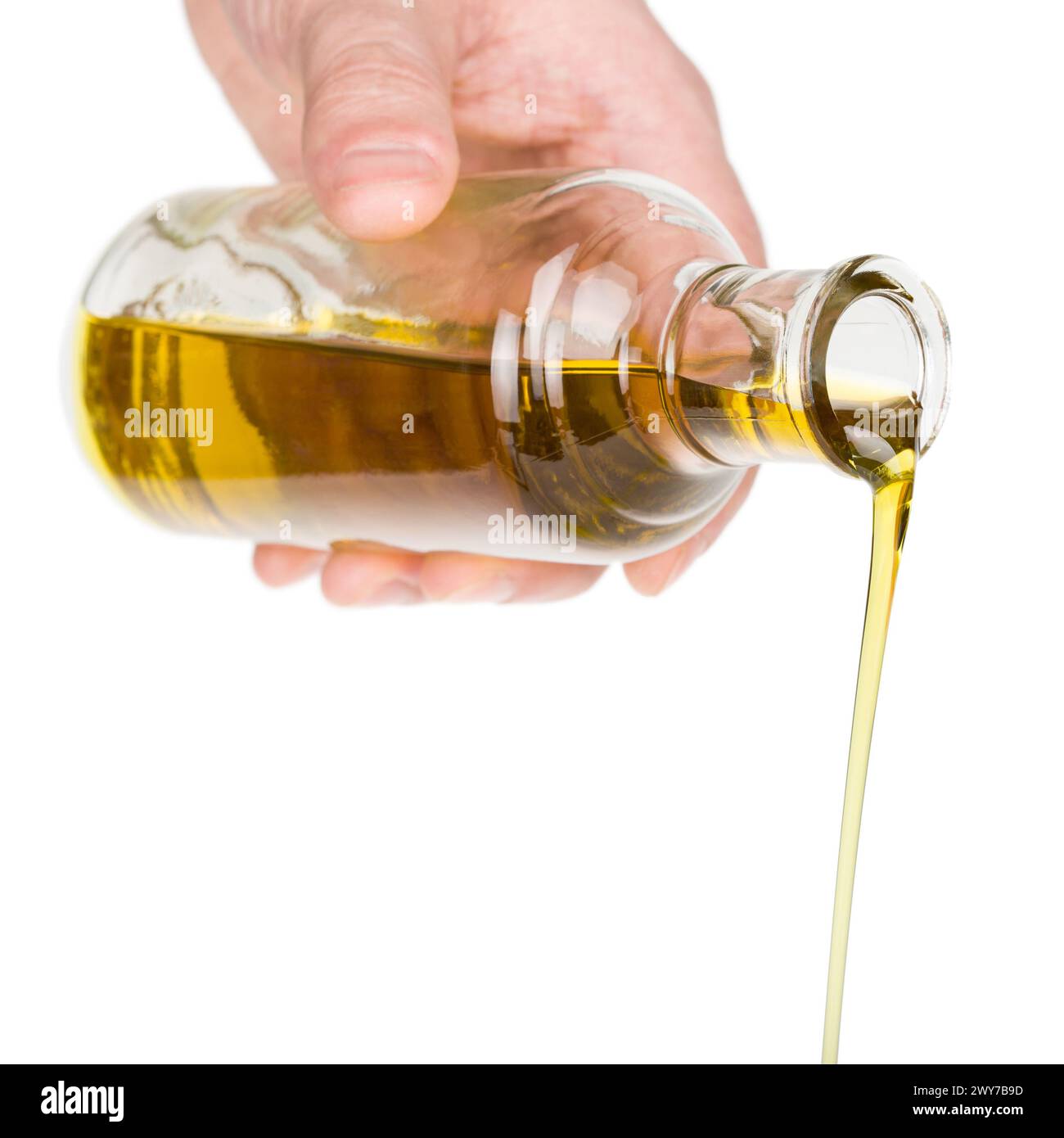 Oil pouring from a bottle Stock Photo - Alamy