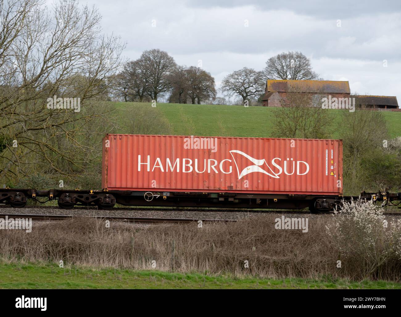 Hamburg Sud shipping container on a freightliner train, Warwickshire ...