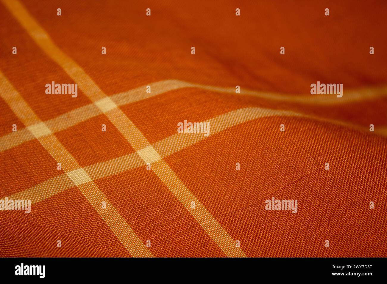 A beautiful sharp orange color Kain Pelikat or Kain Sarong with stripe ...