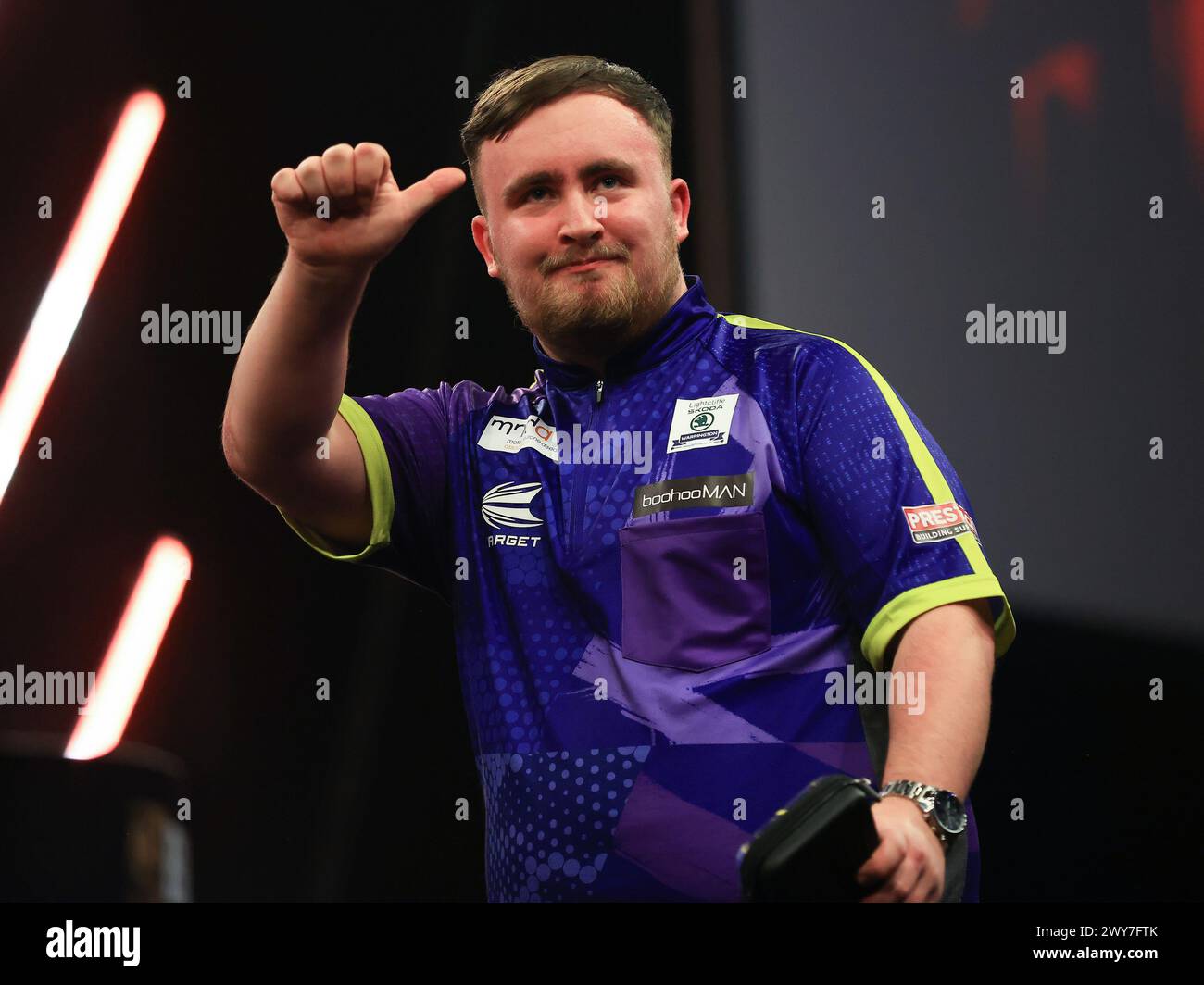 Luke Littler gives the thumbs up after beating Michael van Gerwen ...