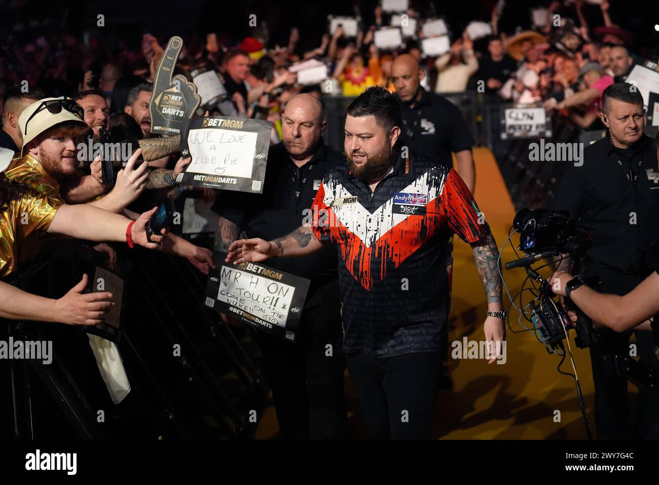 Michael Smith walks out to play Luke Humphries (not pictured) on night ...