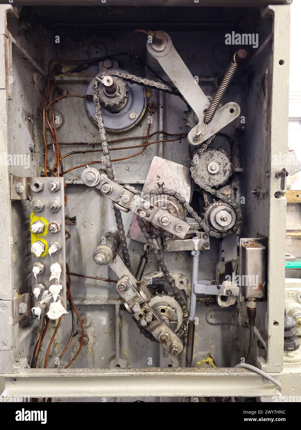 Sprockets and drive chain in an old industrial machine. Keeping ...