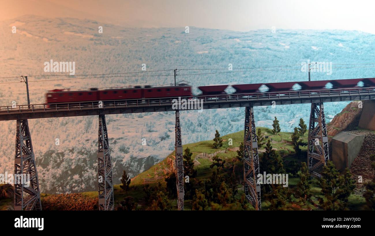 a freight train runs on the tracks of a railway bridge that crosses the ...