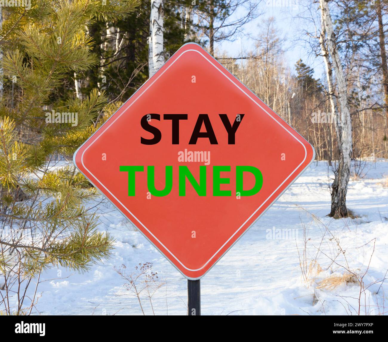 Stay tuned symbol. Concept words Stay tuned on beautiful red road sign ...