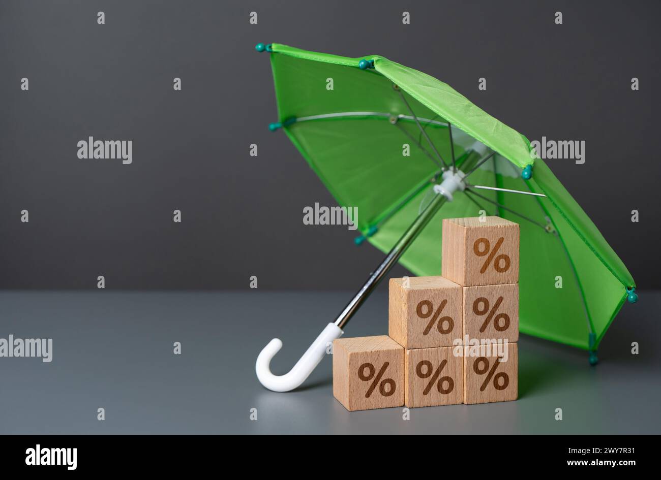 Deposit insurance. Interest under a green umbrella. Protecting savings ...