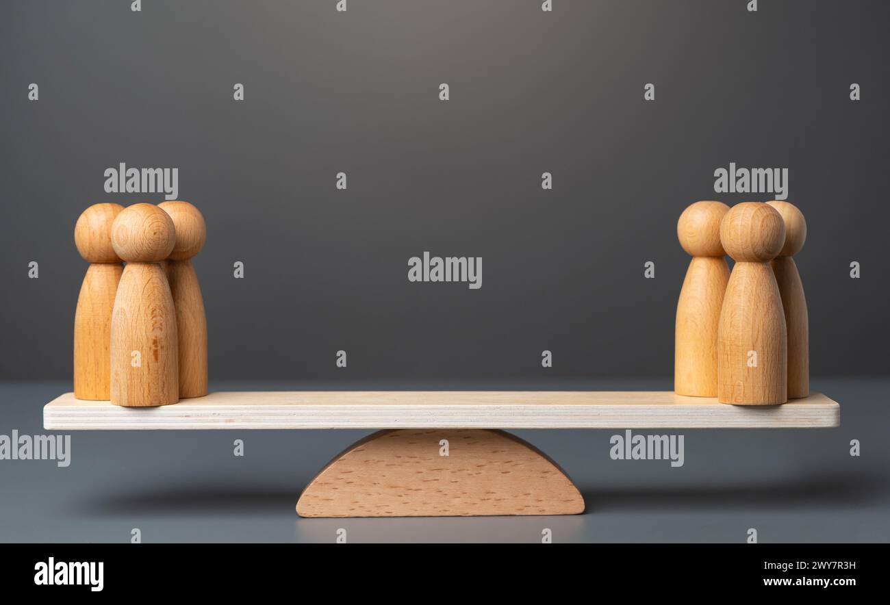 Two opposing groups of people on the scales. Opposing teams. Maintain ...