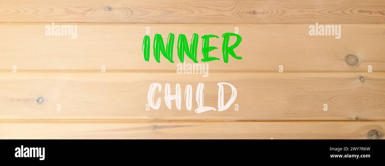 Inner child symbol. Concept words Inner child on beautiful wooden wall ...