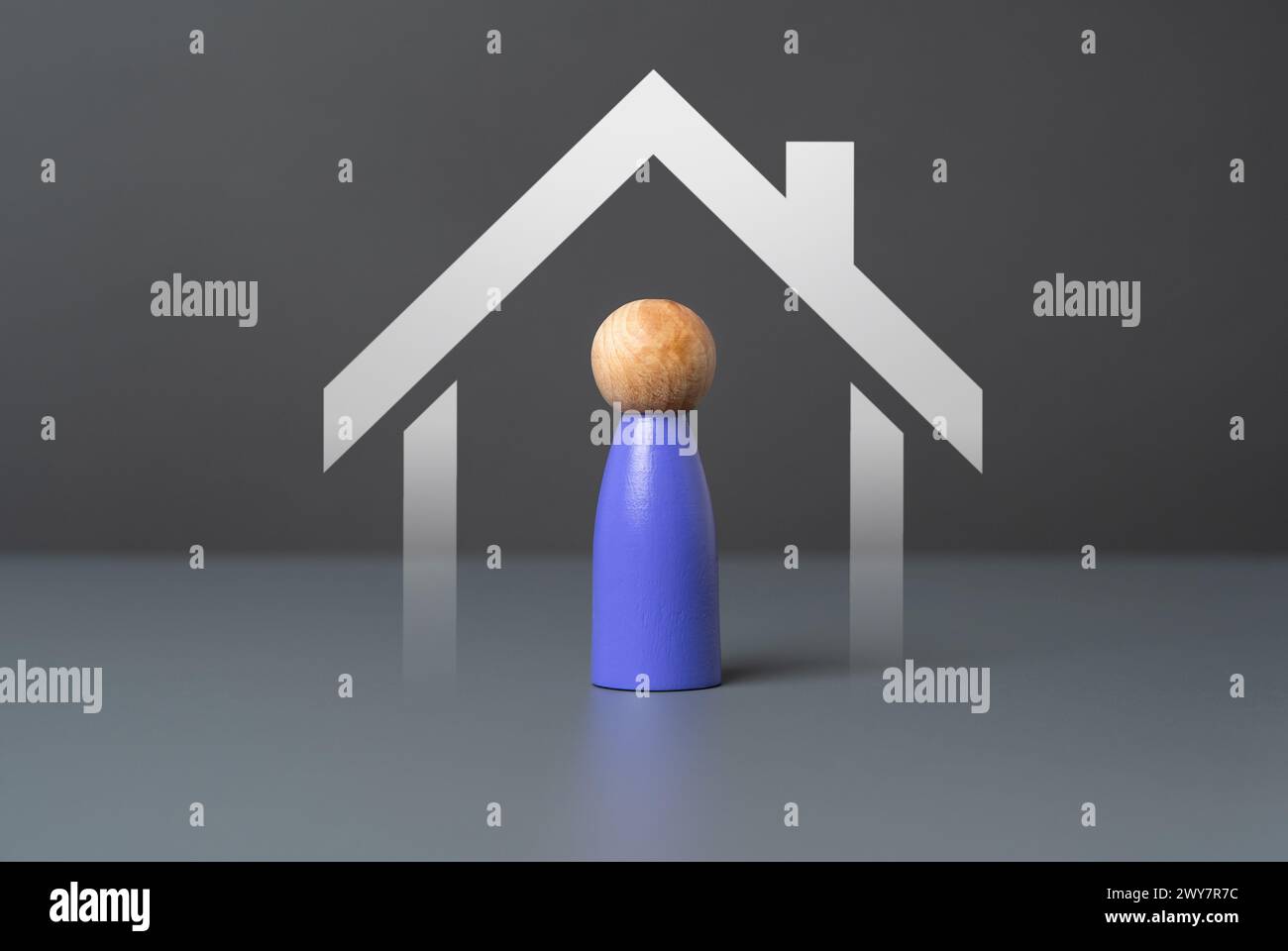 A man under the roof of a house. Providing housing. Affordability ...