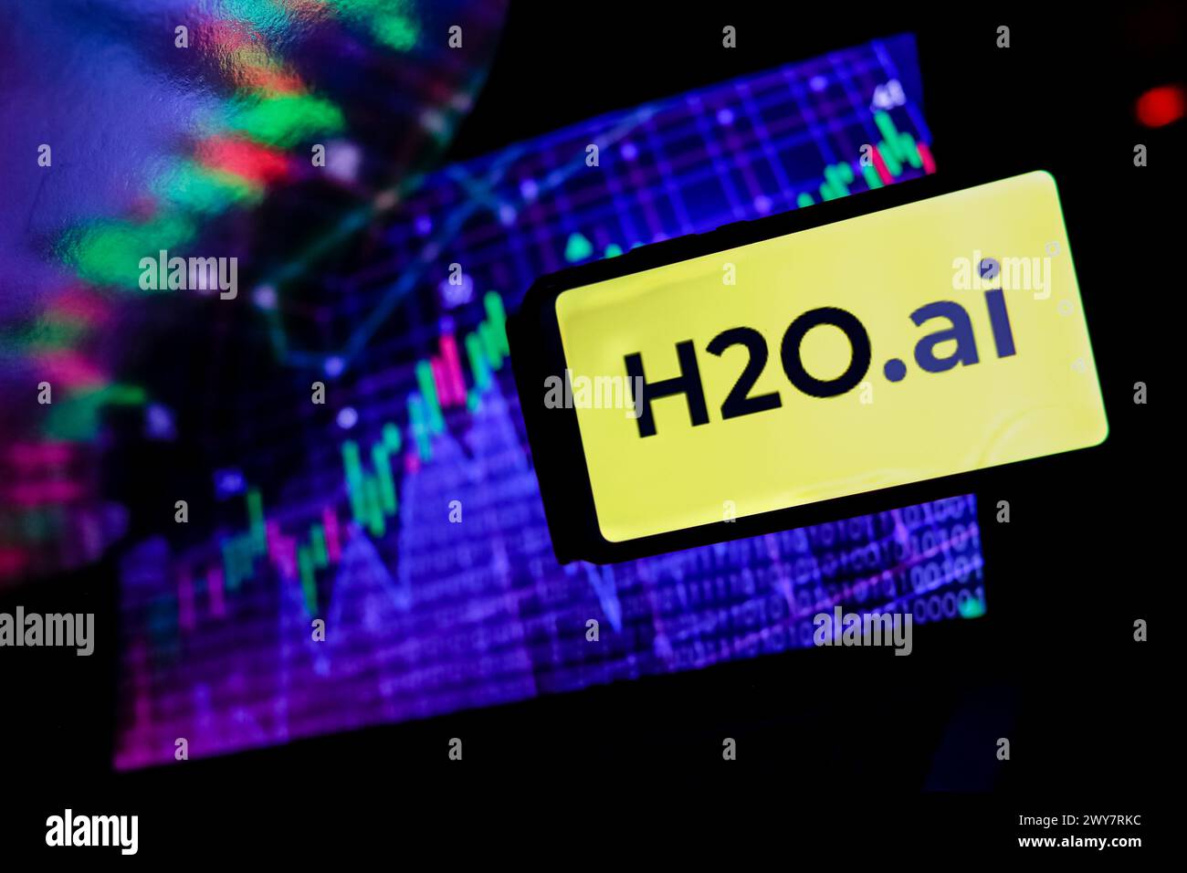 In this photo illustration, a H2O.ai logo is seen on a smartphone with stock market percentages ...