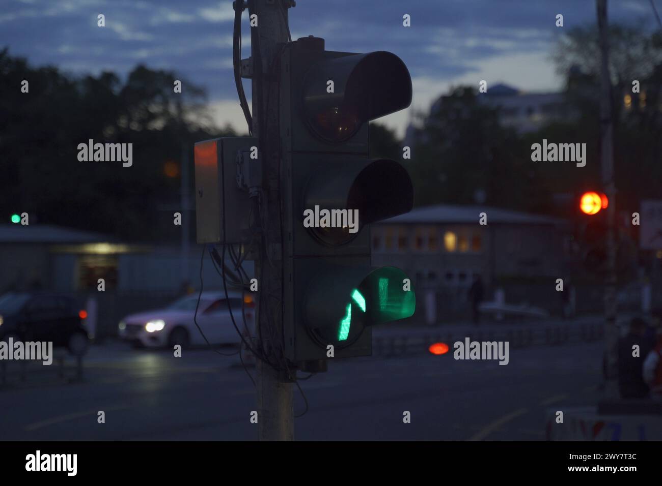 A traffic light displaying a green arrow signal, indicating the right ...
