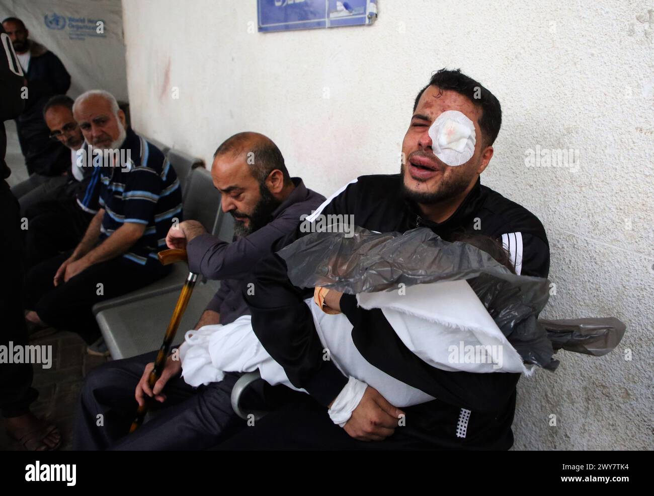 Gaza. 4th Apr, 2024. A man grieves over the body of a victim after an ...