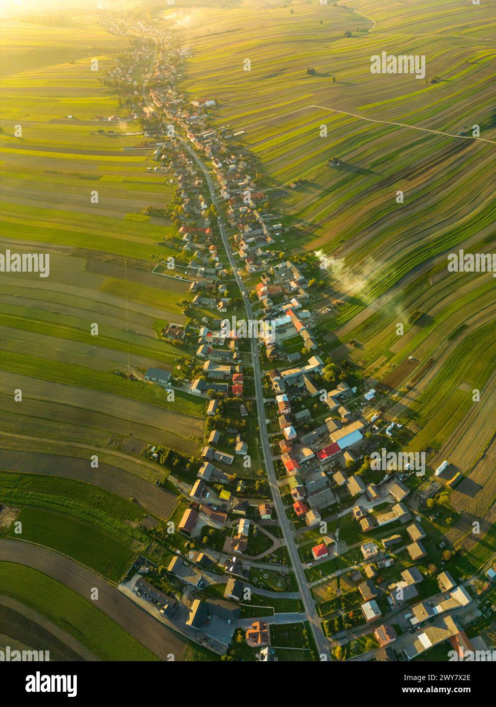 Aerial drone photo of houses along road in Suloszowa village in day ...