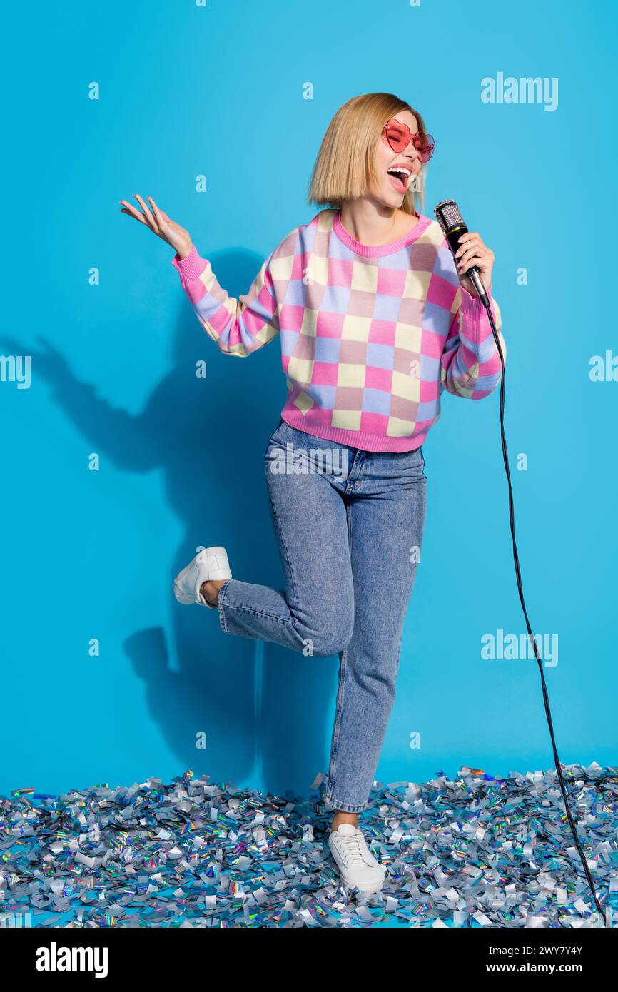 Vertical photo of pretty young girl sunglass celebrate party sing mic ...