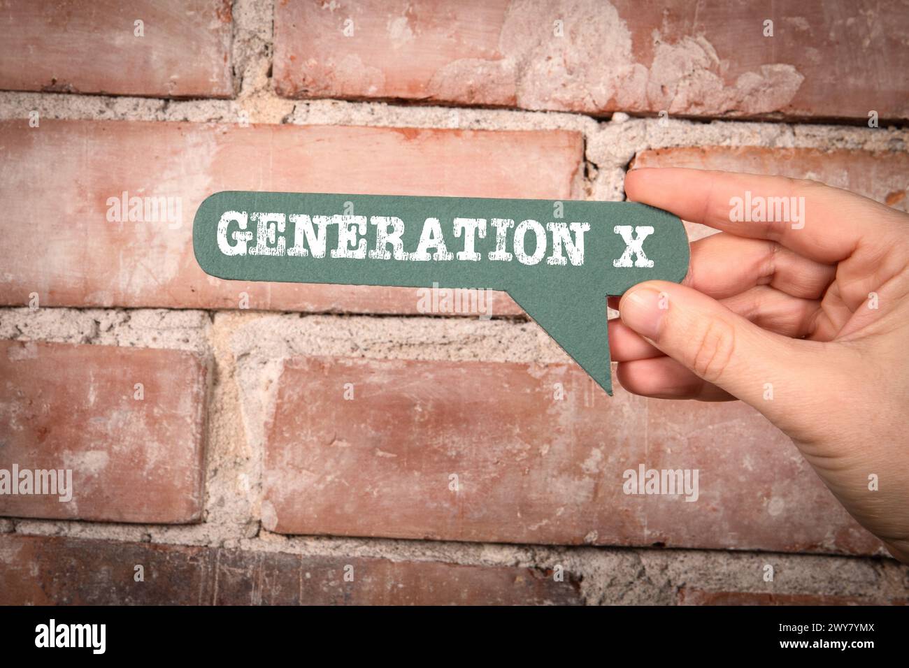 Generation X Concept. Green speech bubble with text on a red brick ...
