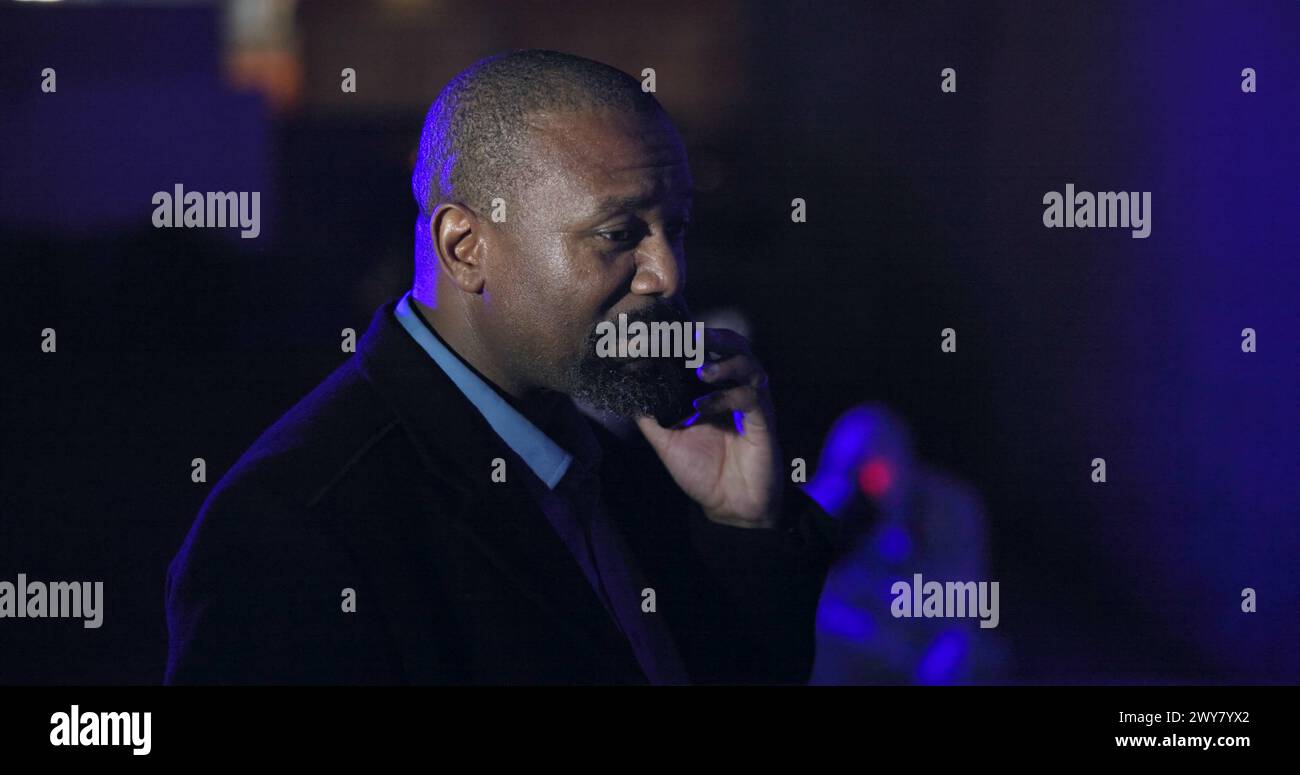 Police, man and phone call for talking at crime scene, investigation ...