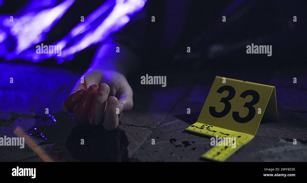 Crime scene, dead body and accident at night in street with police sign ...