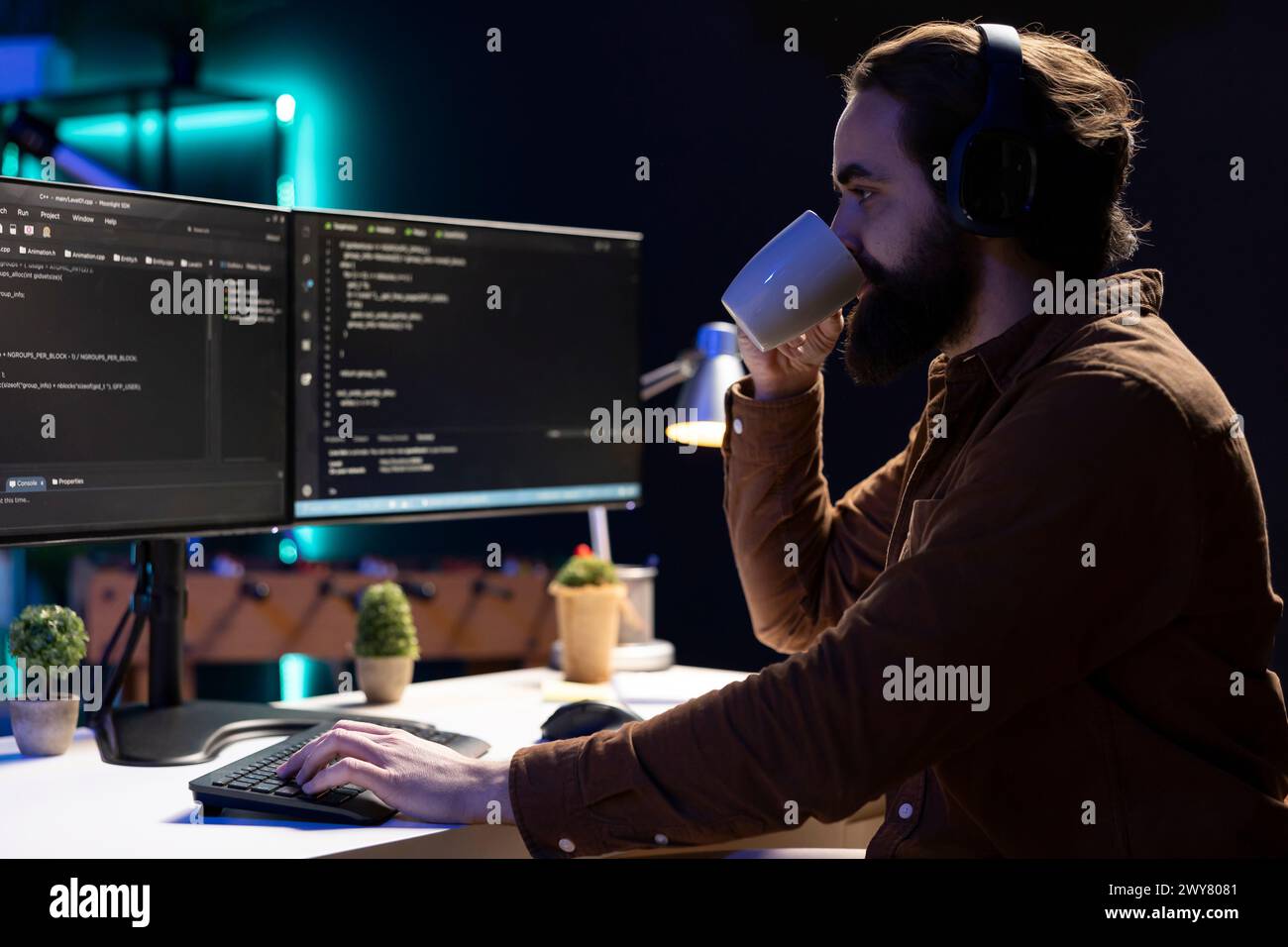 Cybersecurity Specialist Drinking Coffee While Looking For Company Security Vulnerabilities And