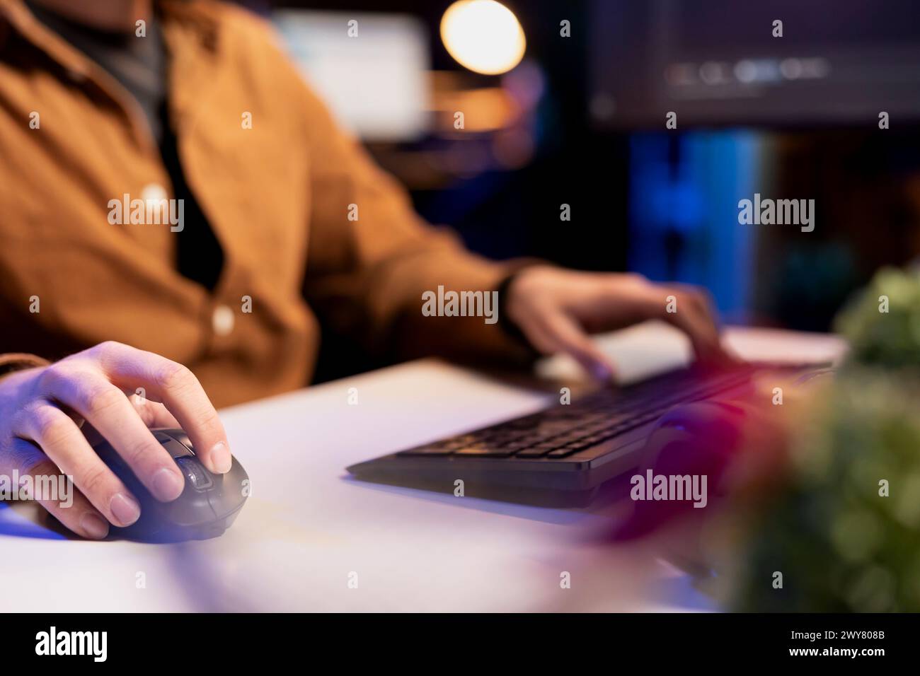Man Doing Software Quality Assurance Using Keyboard And Mouse Reading Source Code On Computer