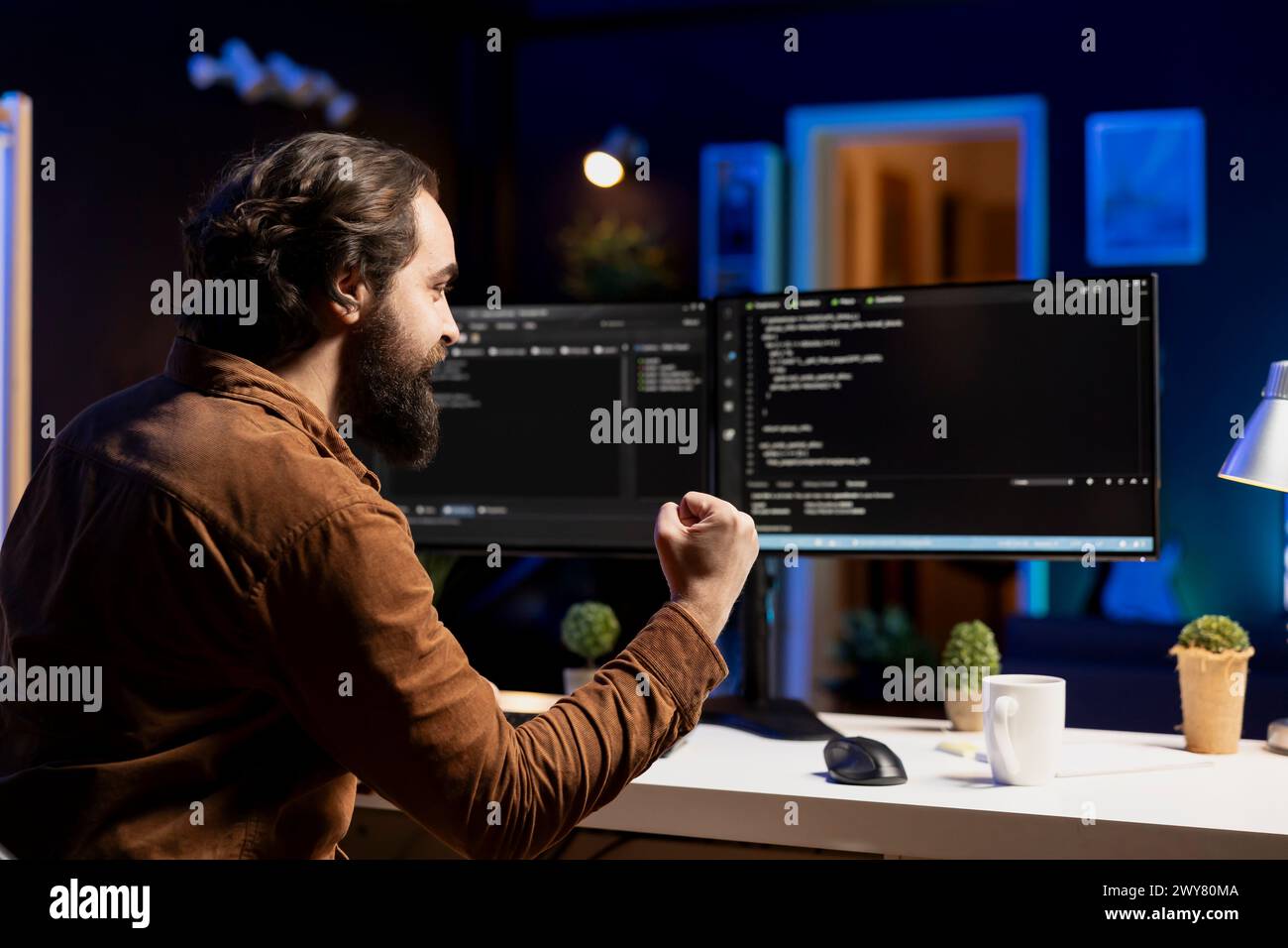 Happy man doing software quality assurance celebrating after reading source code and finding no ...