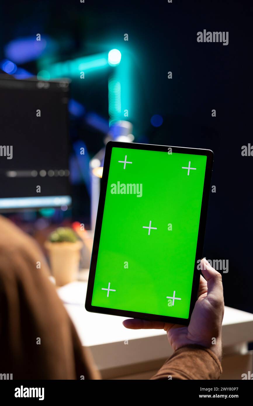 Cybersecurity expert using green screen tablet to secure company ...