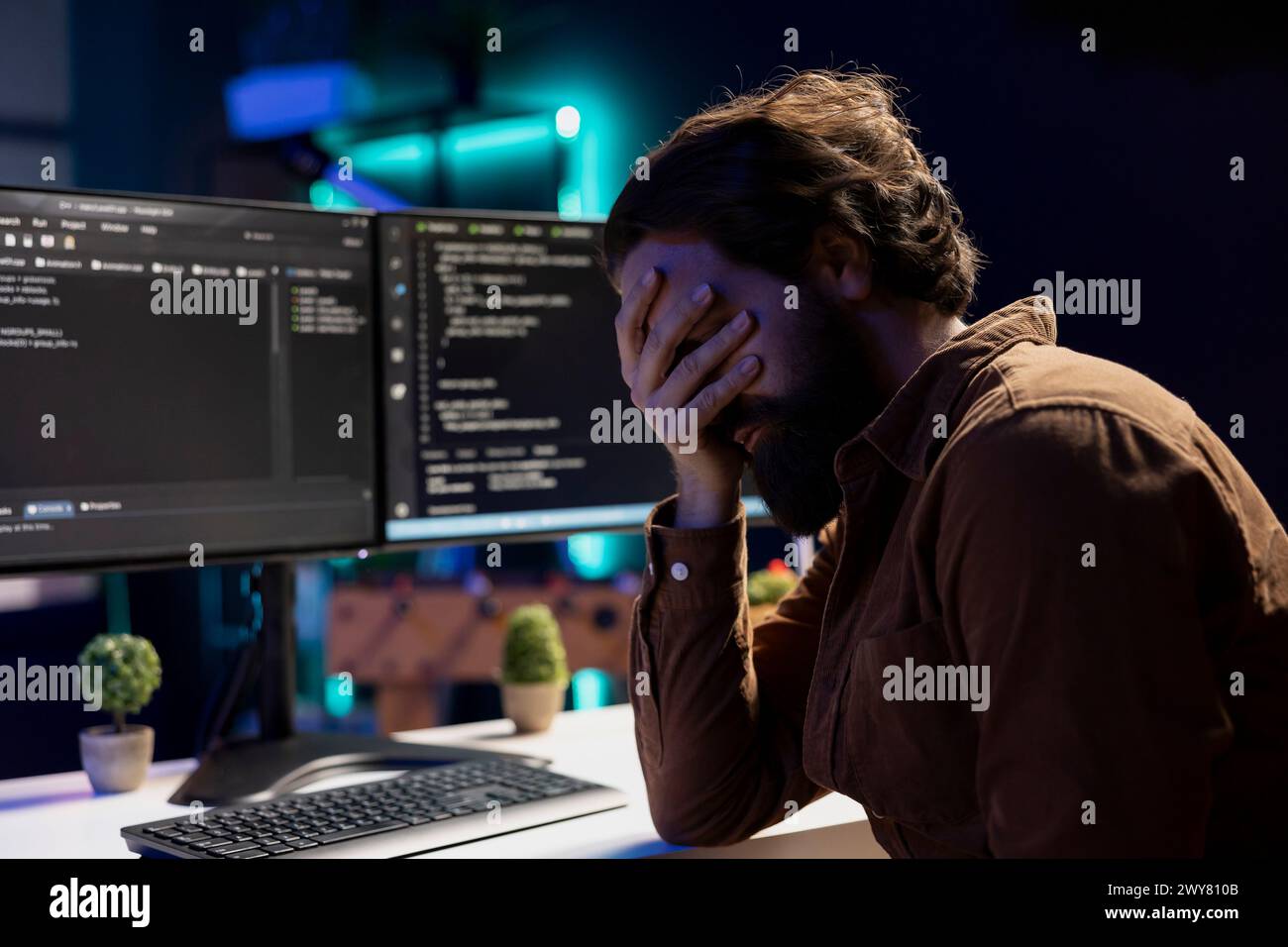 Troubled Man Facepalming Himself While Doing Software Quality Assurance Finding Major Errors In