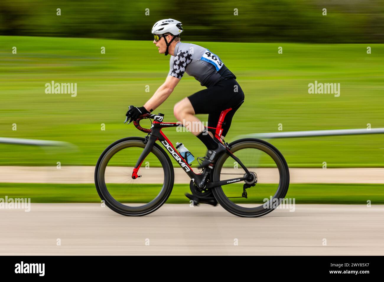 Two cyclists racing on street in action Stock Photo - Alamy